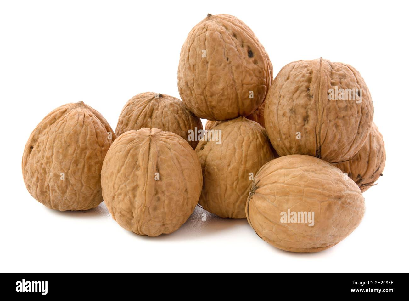 A handful of walnuts. Nuts isolated on white background Stock Photo - Alamy