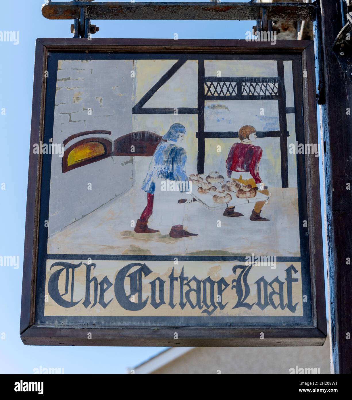 Traditional hanging pub sign at The Cottage Loaf public house, Market ...