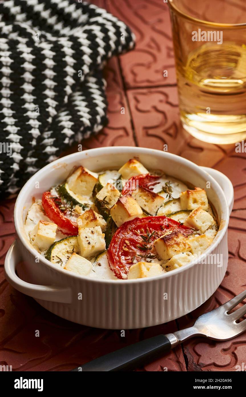 Bulgur wheat bake with zucchini, tomatoes and sheep's cheese Stock ...