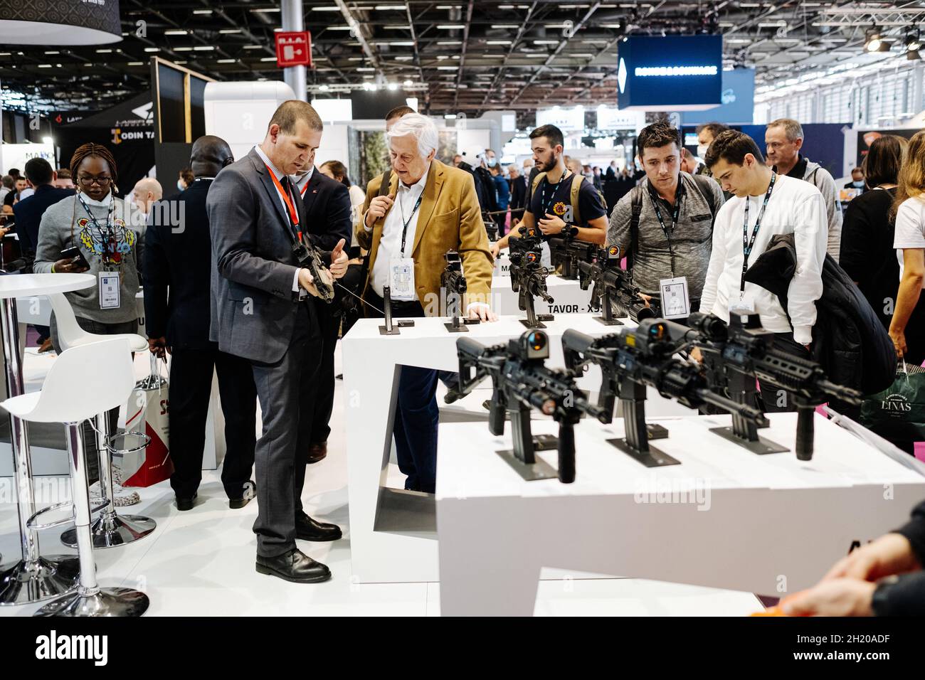 People try riffles at the Milipol exposition. The Milipol exhibition is ...