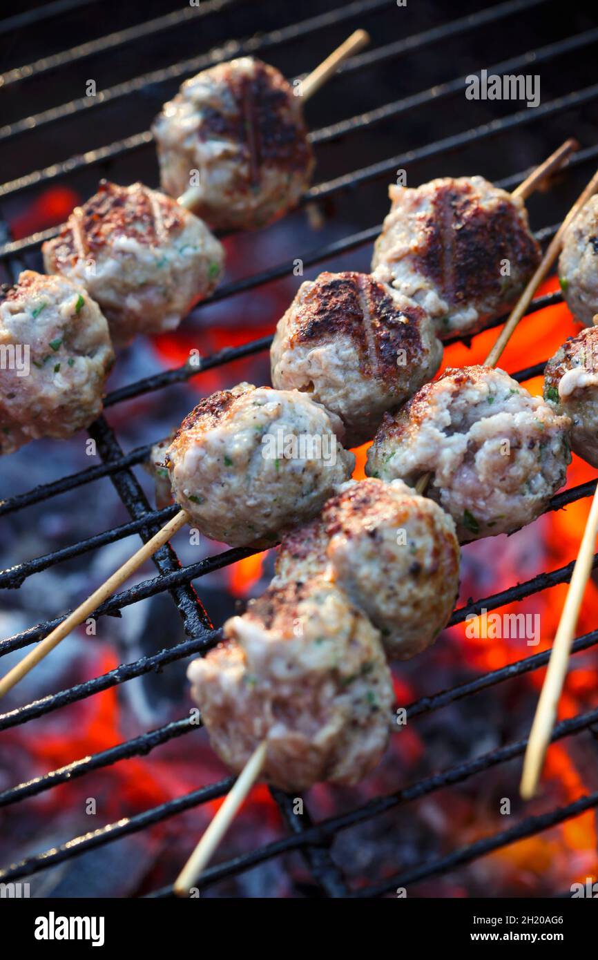 Meatballs on a grill rack Stock Photo - Alamy