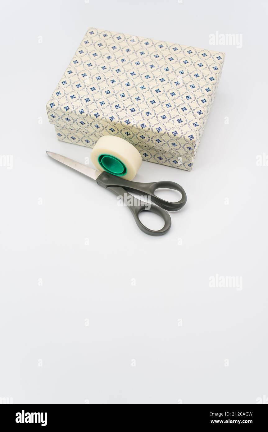 decorated paperboard box with lid on top and stationery on a white ...