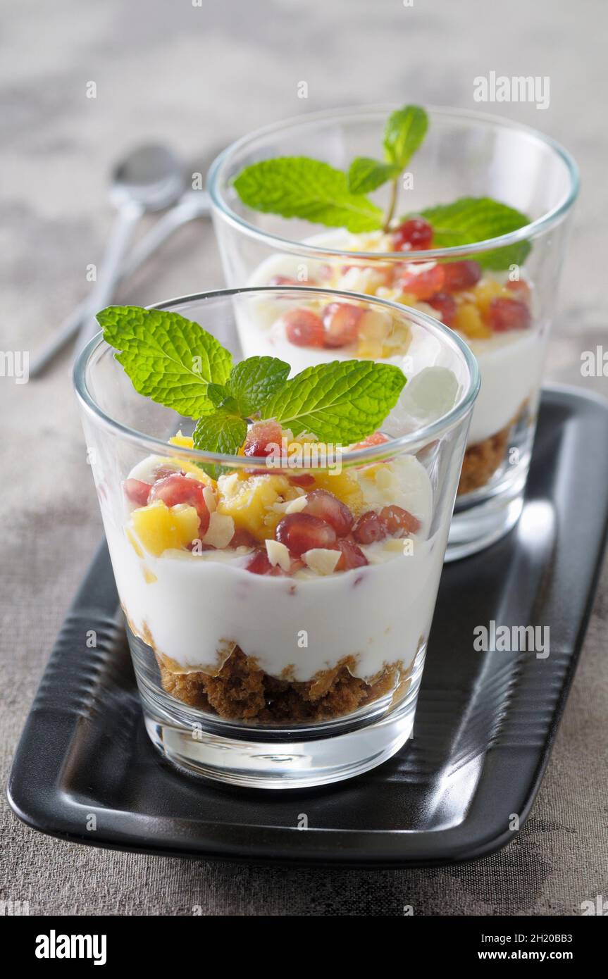 Quick mango and pomegranate trifles Stock Photo - Alamy