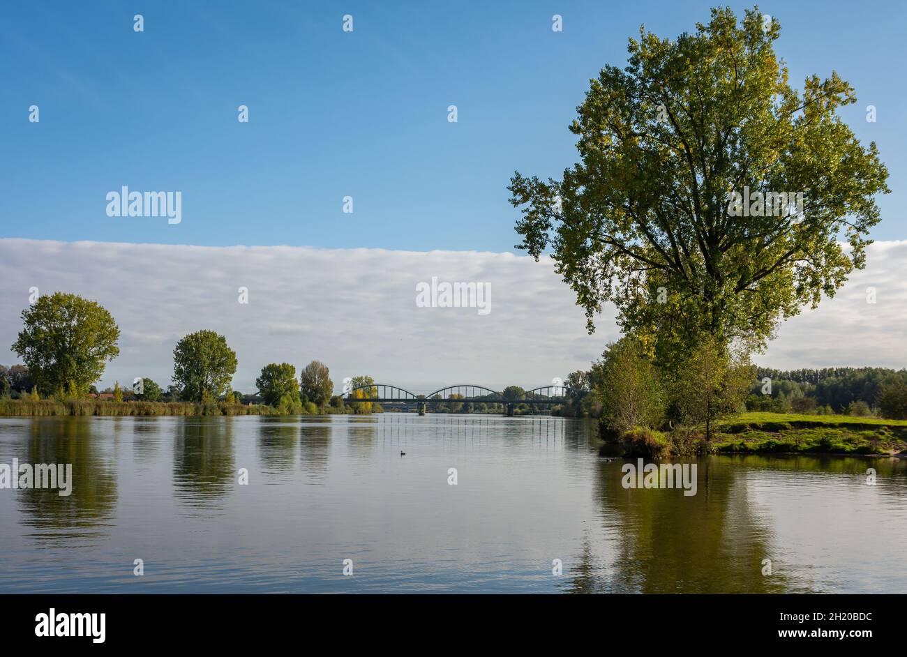 Autumn landscape of Meuse river around village of Demen with distant ...
