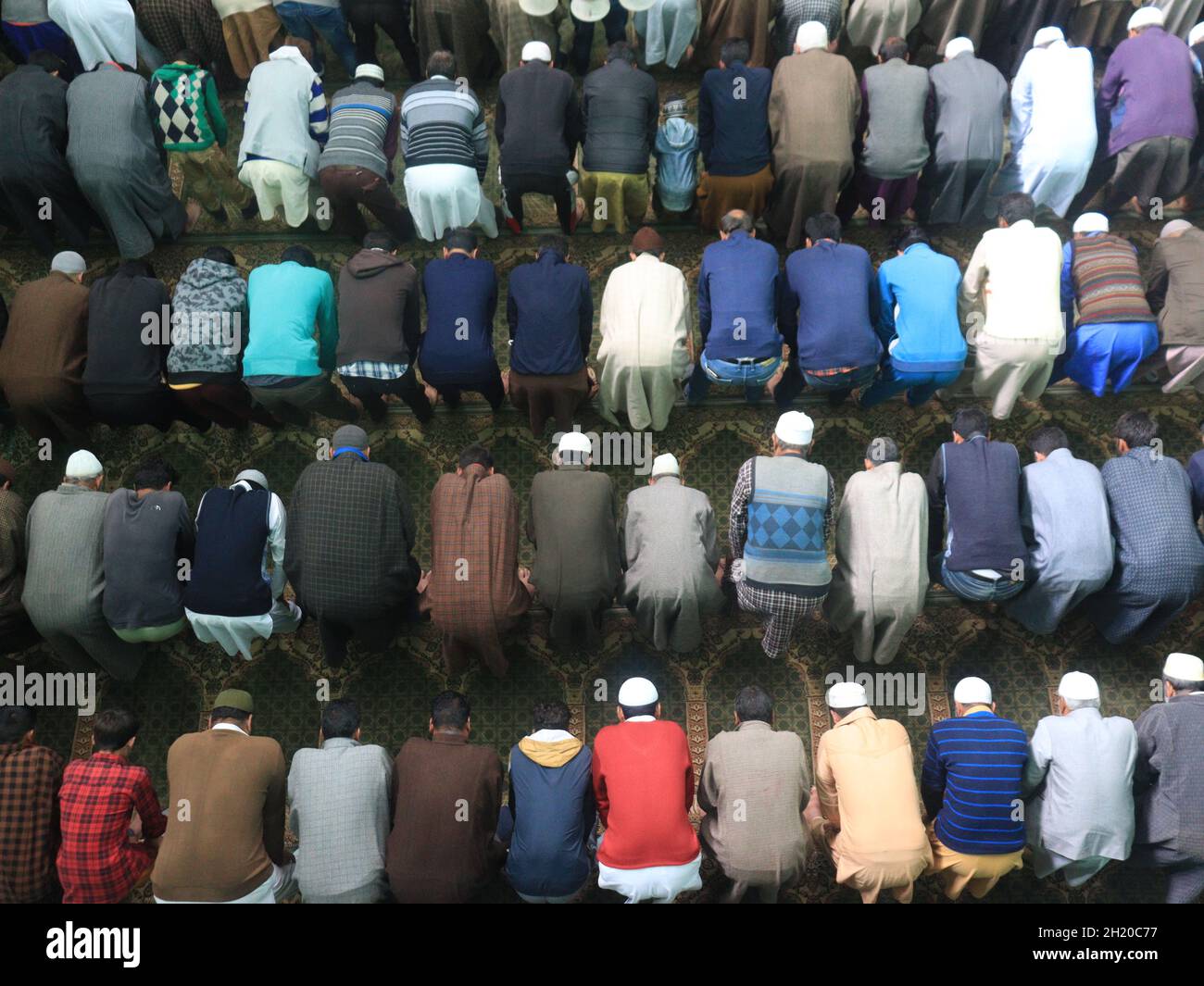 Anantnag, India. 19th Oct, 2021. Muslims offer prayers and have a ...