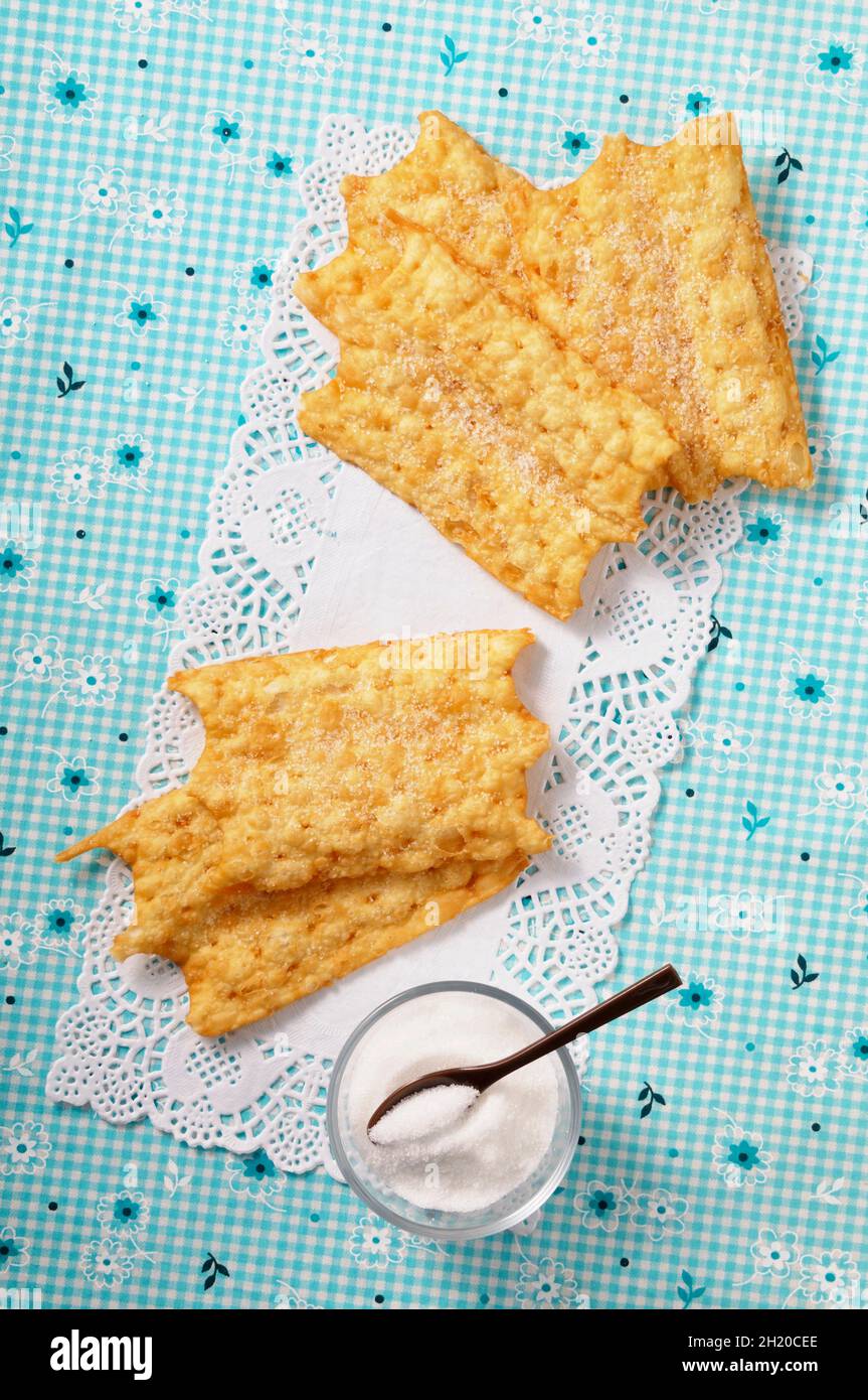 Oreillettes (deep-fried pastries, France) with sugar Stock Photo - Alamy