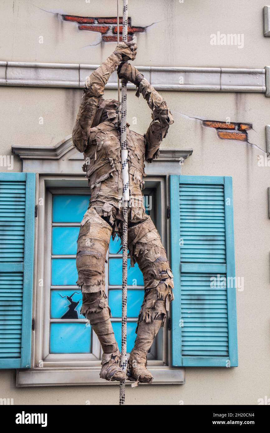 a fleeing fearless horror figure who is hanging on a rope Stock Photo ...