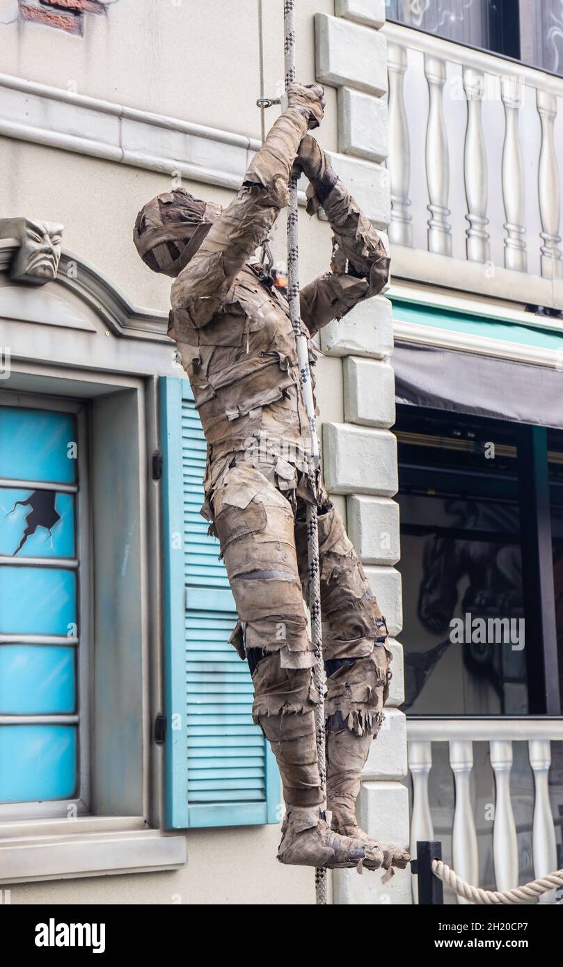 a fleeing fearless horror figure who is hanging on a rope Stock Photo ...