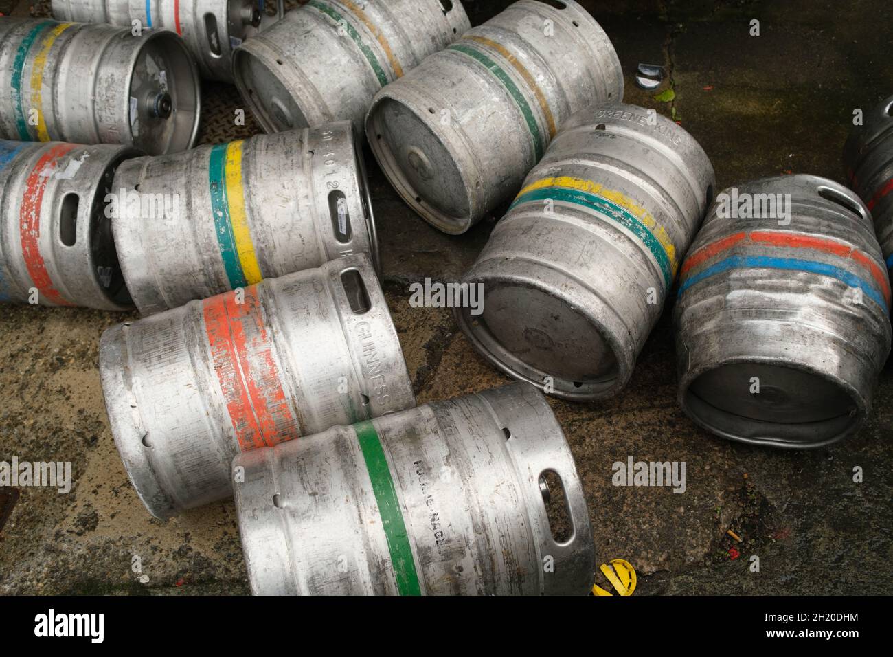 Colour coded beer kegs outside a pub Stock Photo - Alamy