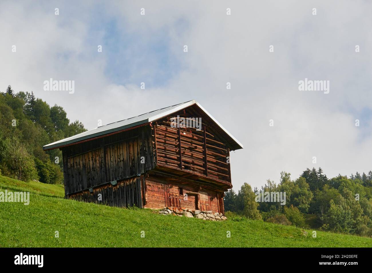 Hay Barn In The Typical Surselva Architectural Style On Alpine Pasture ...