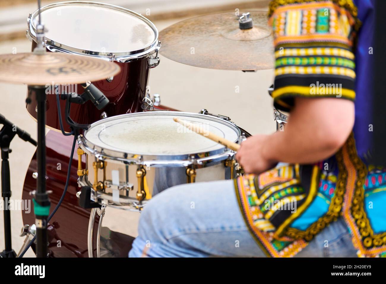 Drummer playing musical percussion instrument drums with sticks ...
