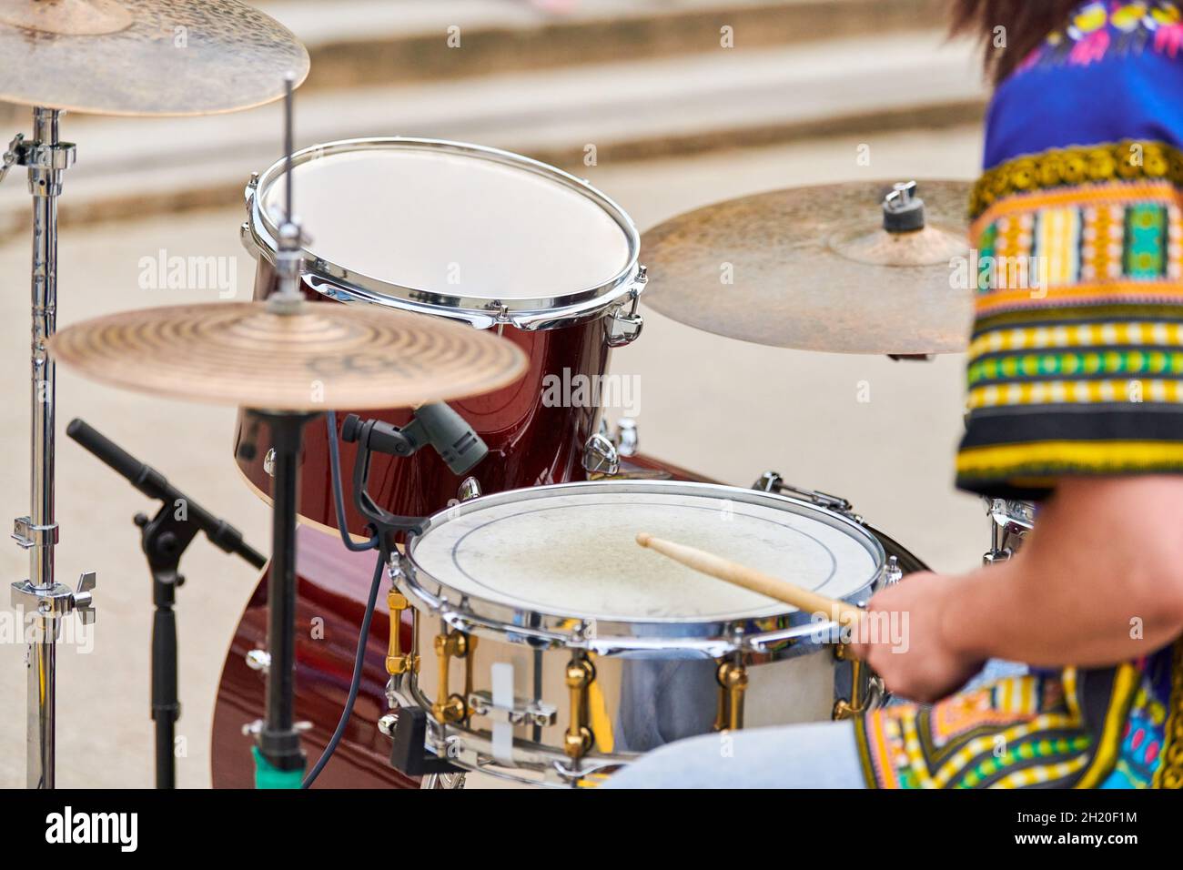 Drummer playing musical percussion instrument drums with sticks ...