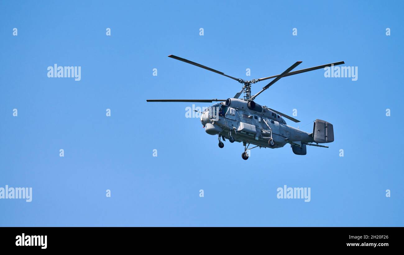 Navy helicopter flying against clear blue sky background, copy space ...
