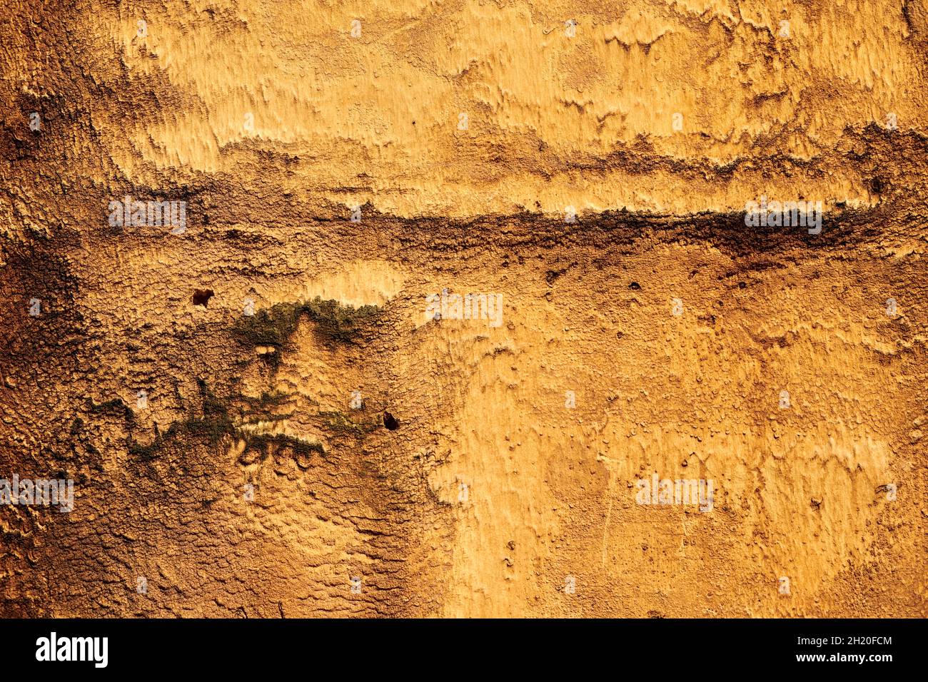 Abstract background of rough yellow wall texture, copy space. Vintage ...