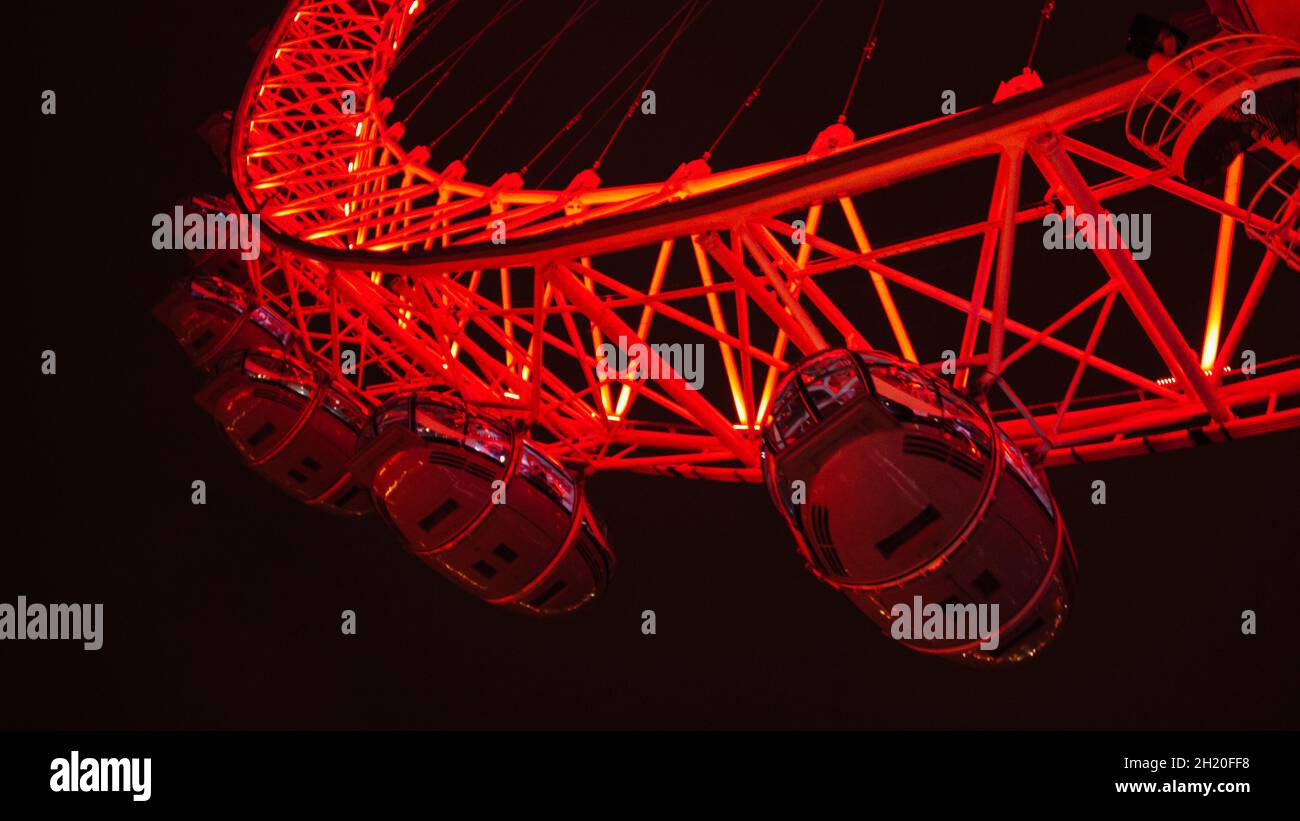The London Eye illuminated red at night. London, England Stock Photo ...