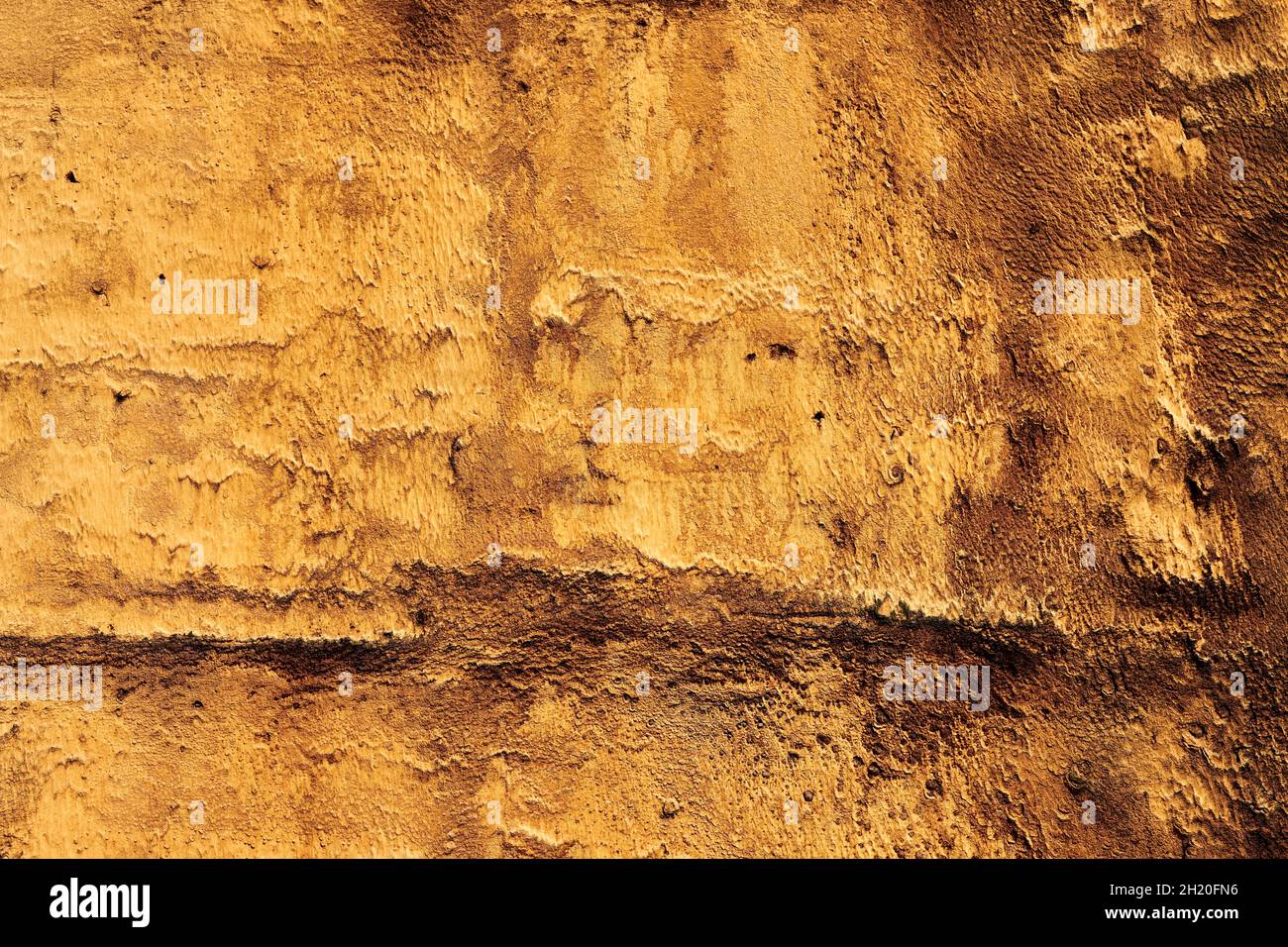 Abstract background of rough yellow wall texture, copy space. Vintage ...