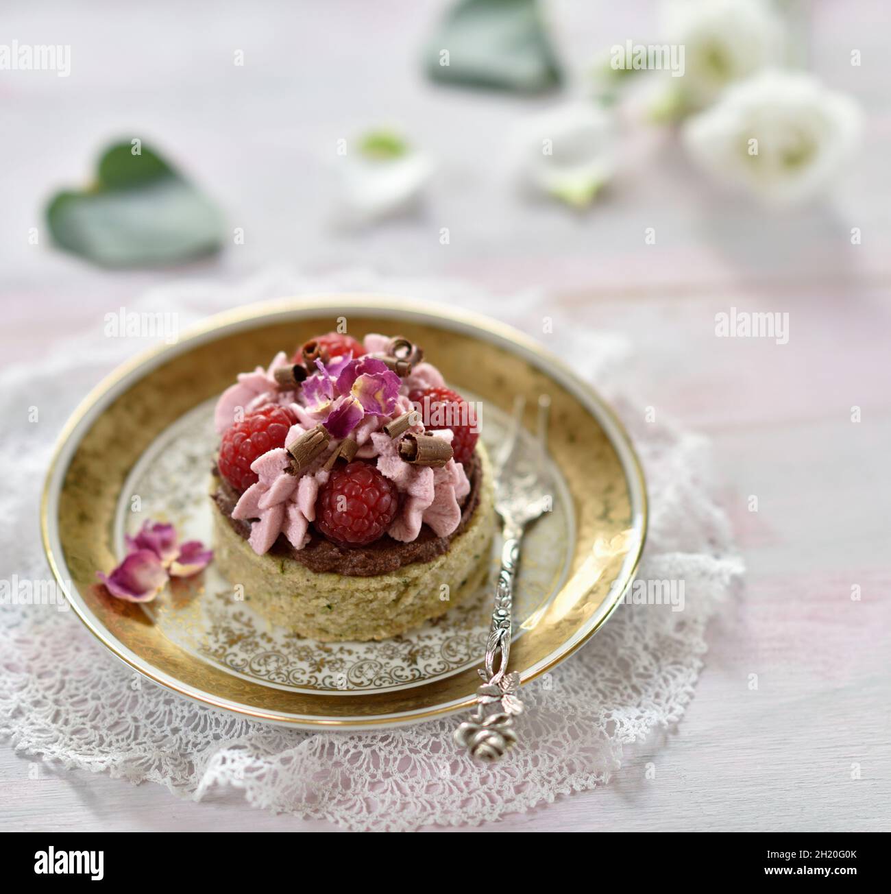 Vegan courgette cake with chocolate ganache, raspberry mousse, fresh ...