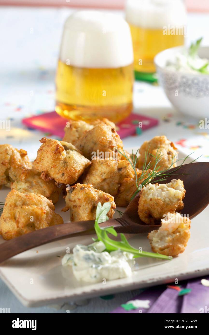 Spicy crab fritters with rocket dip Stock Photo - Alamy