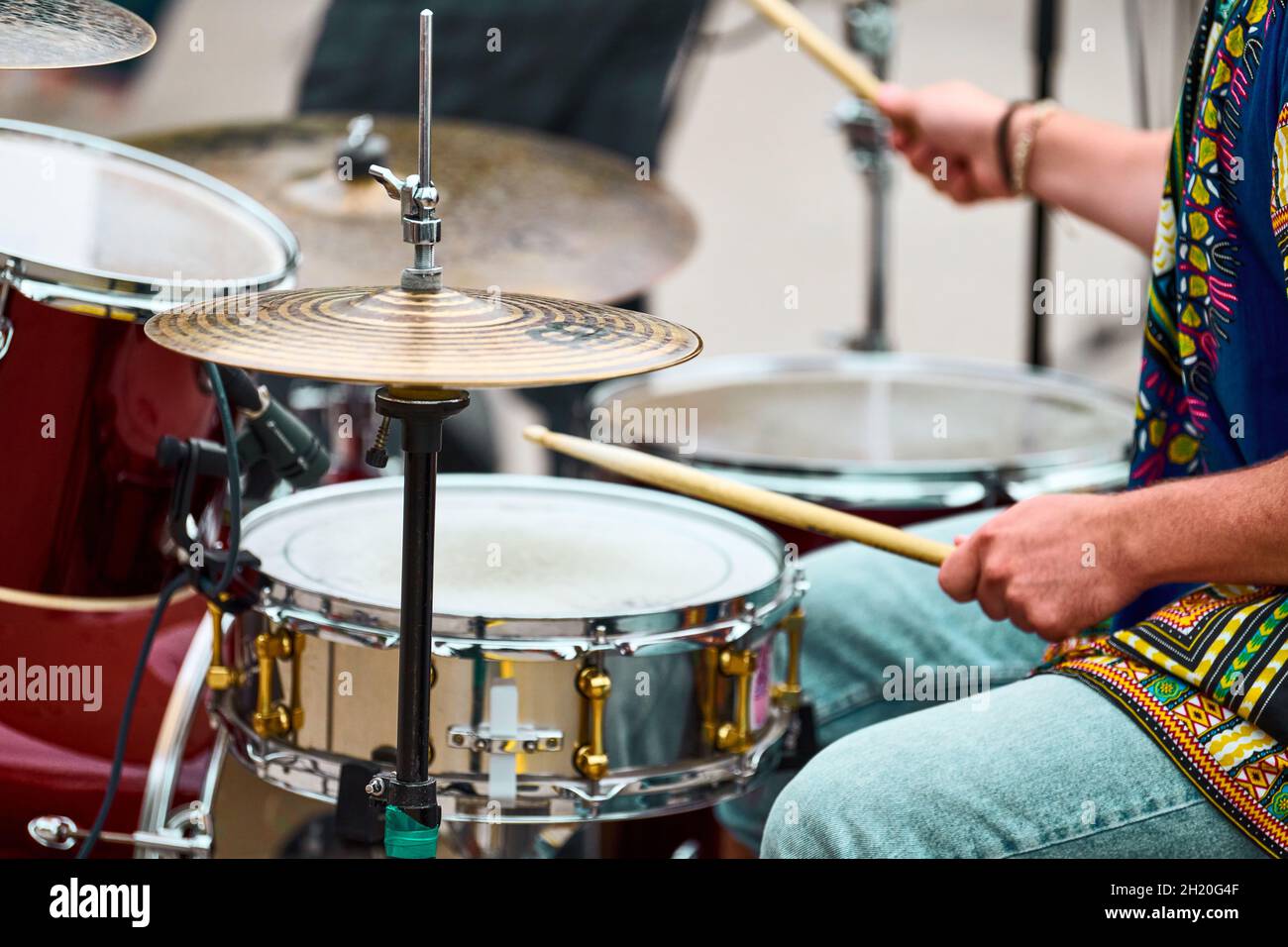 Drummer man playing drums percussion with drumsticks, male hands ...