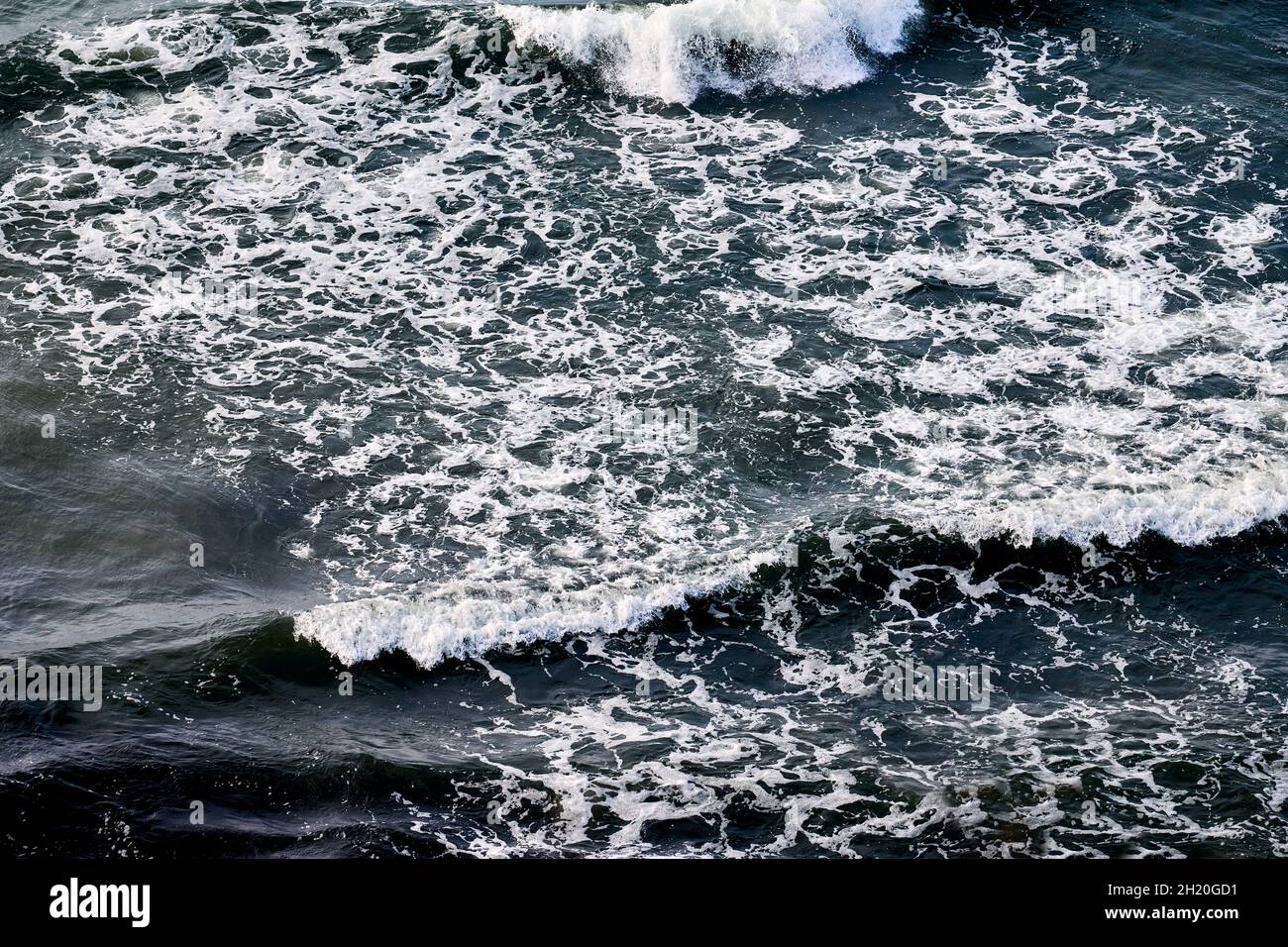 Deep blue sea waters splashing with foamy waves. Aerial view of ocean ...