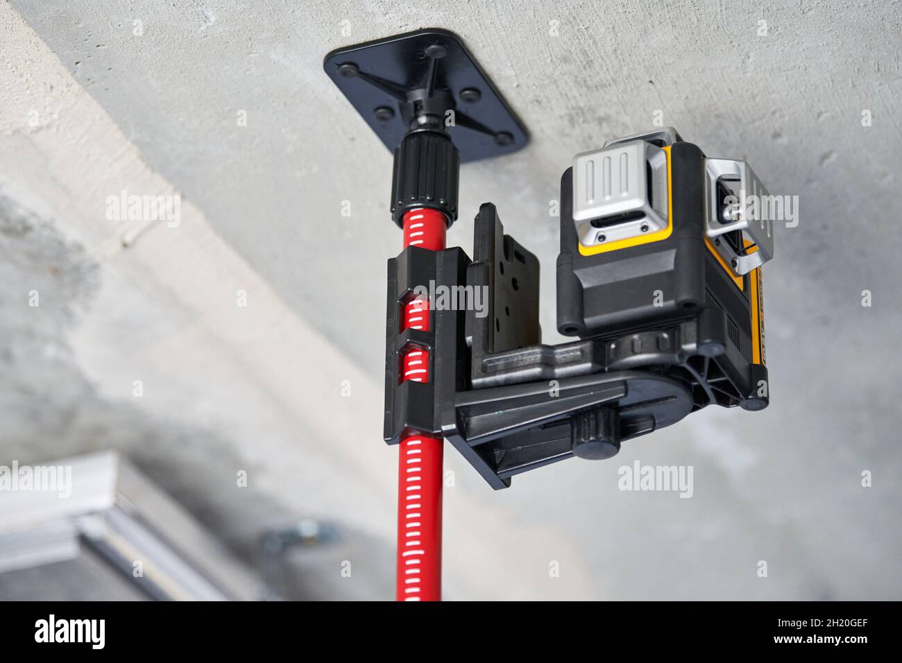 Laser level measuring tool at construction site, close up. Measuring ...