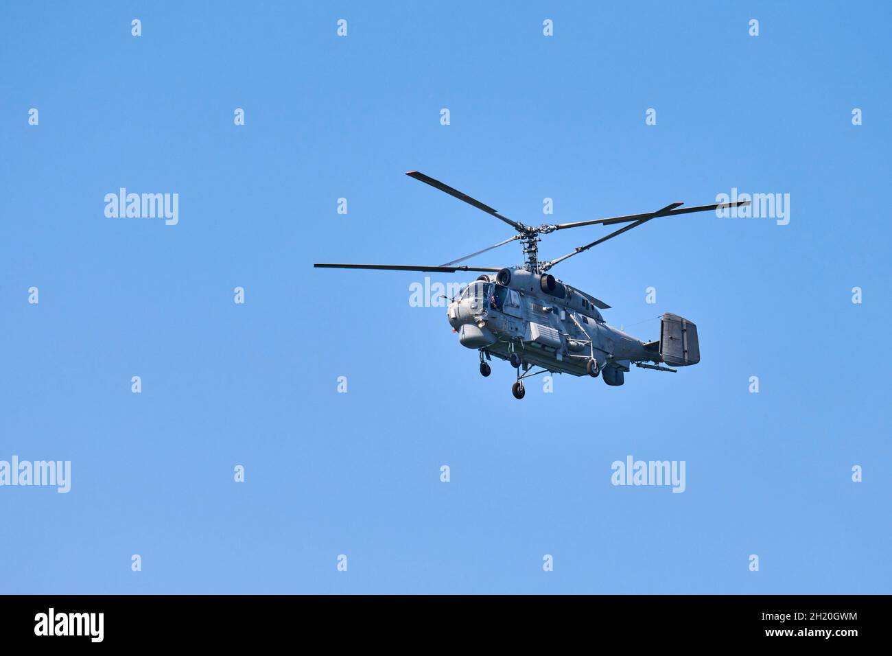 Navy helicopter flying against clear blue sky background, copy space ...