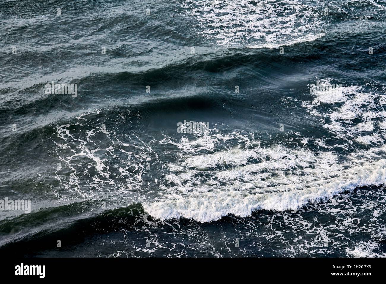 Deep blue sea waters splashing with foamy waves. Aerial view of ocean ...