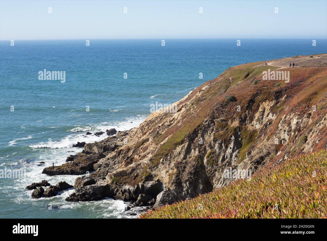People walking on a cliffside trail at Bodega Head in California Stock ...