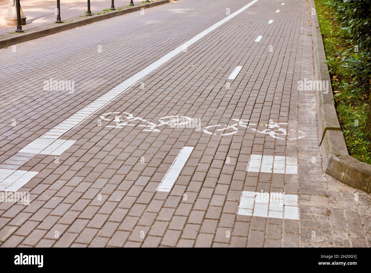 Two way cycle path, marking bike path on sidewalk, white painted ...