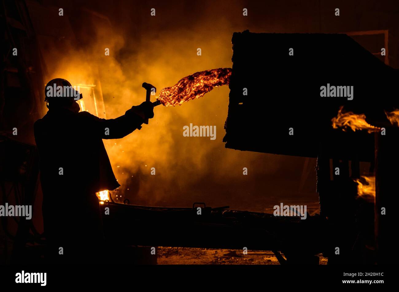 process of taking a sample of liquid metal in a steelmaking furnace ...