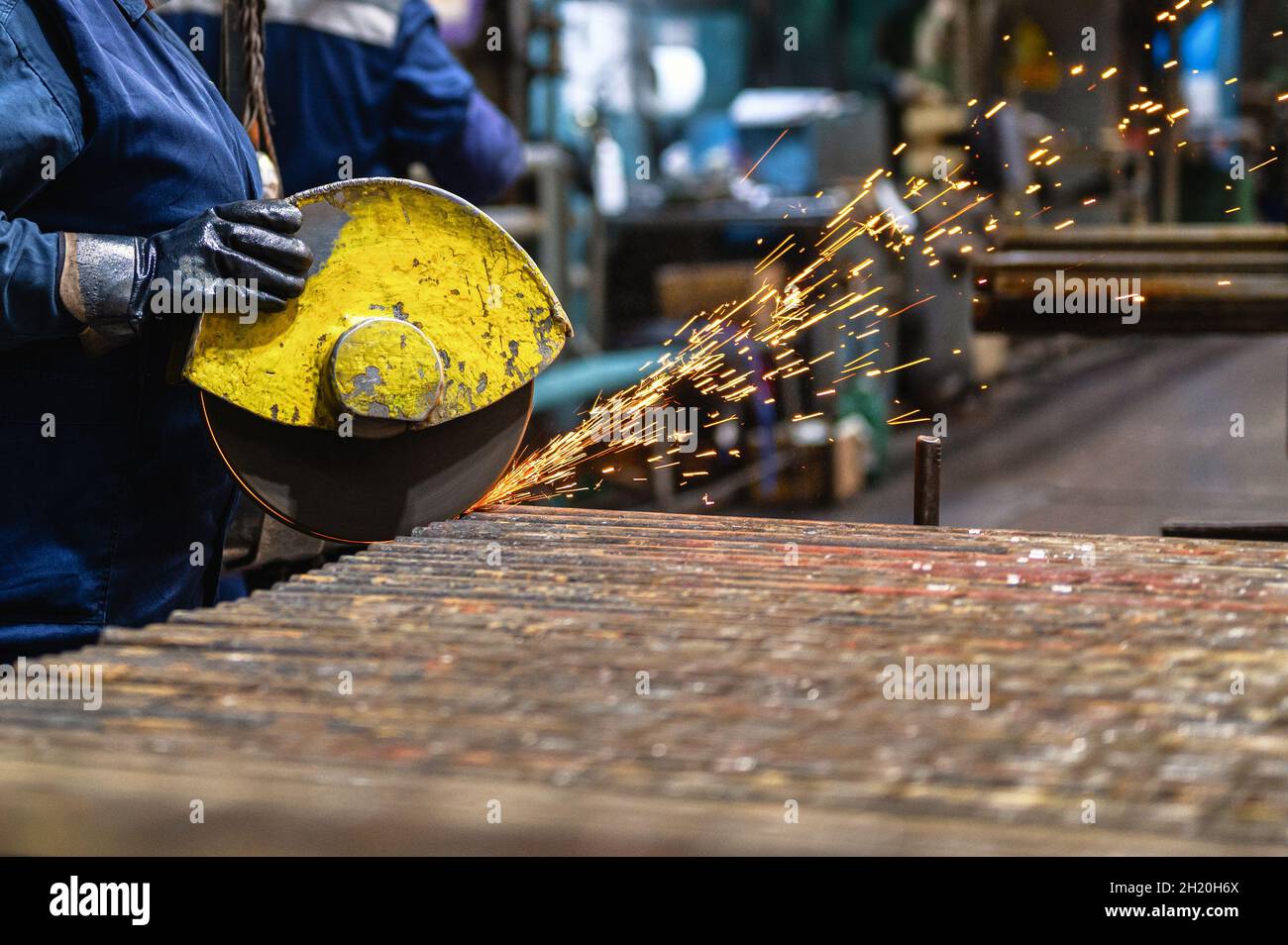 Cutting rolled metal using a powerful abrasive wheel cutting machine ...