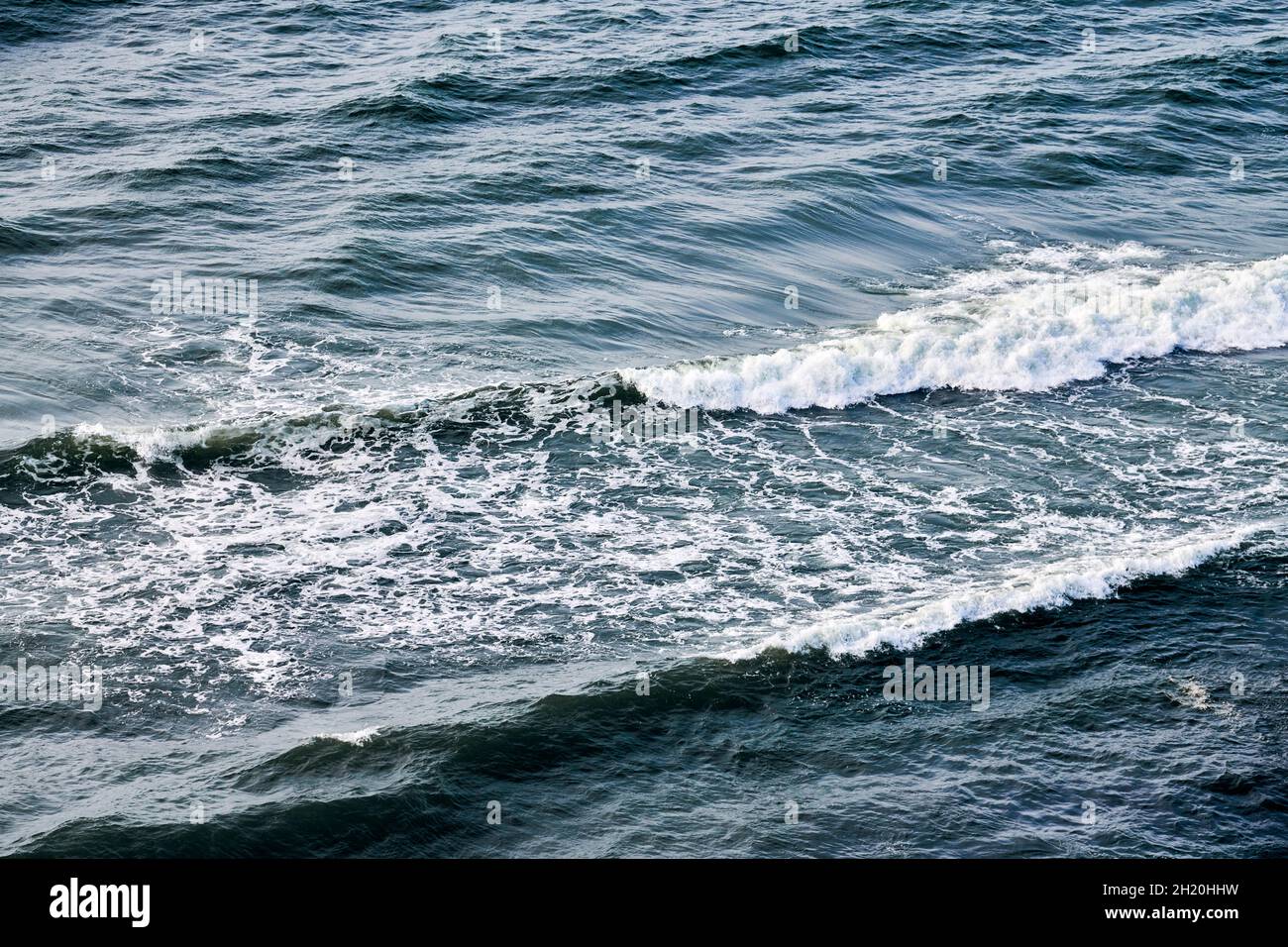Deep blue sea waters splashing with foamy waves. Aerial view of ocean ...
