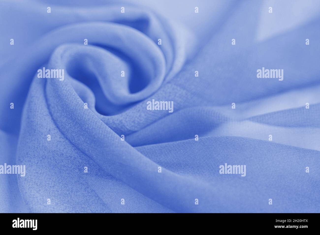 Light blue silk textile industry and fabric background Stock Photo - Alamy