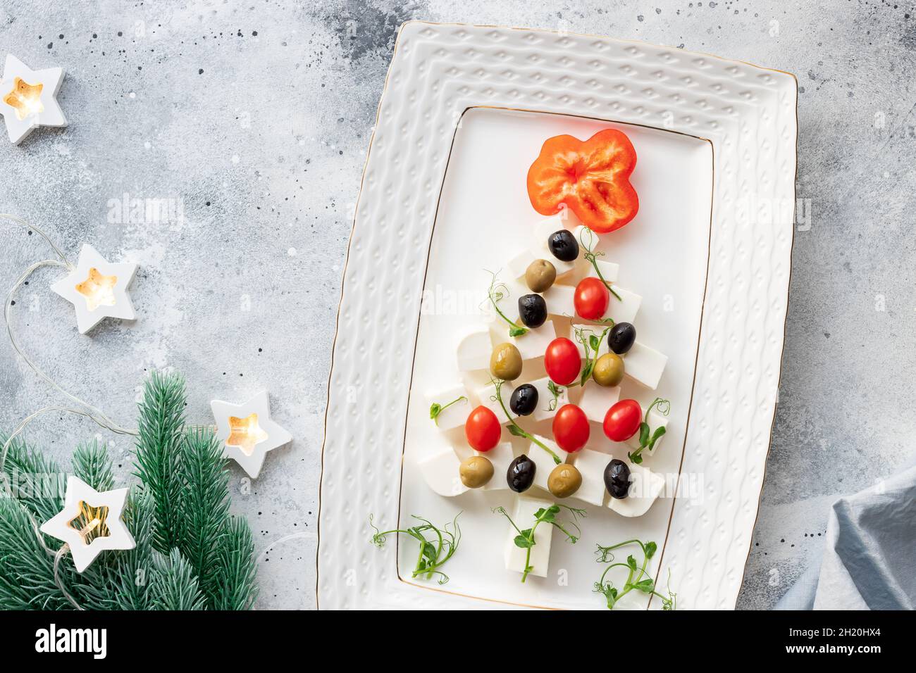 Christmas tree of feta cheese, vegetables and microgreens Stock Photo ...