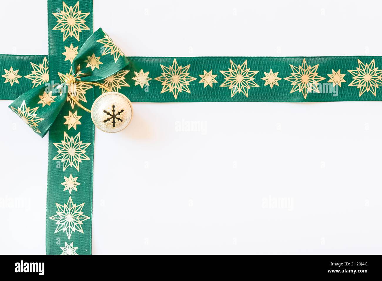isolated golden jingle bells and adorned ribbon on white background ...
