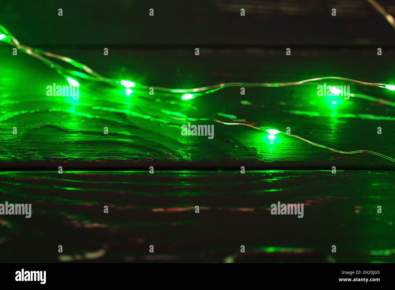 Garland with green light elements in the dark close up Stock Photo - Alamy