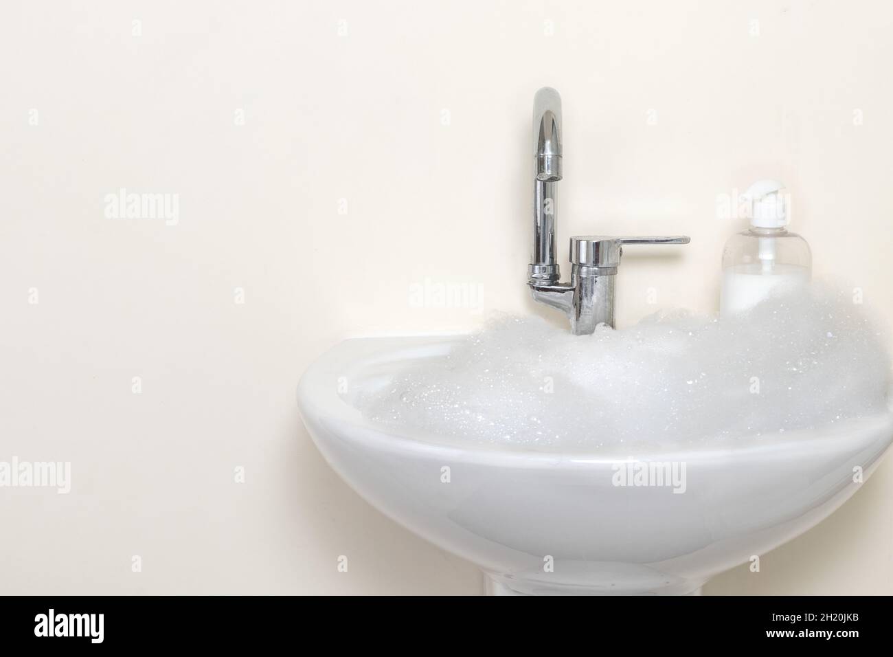 Close up photo of an ocd patient while washing hands for long periot of ...