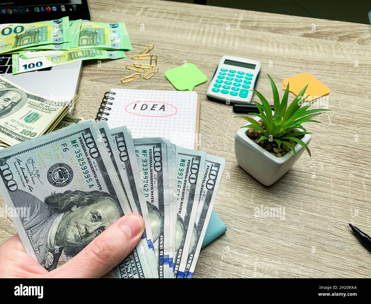 Woman counting dollar bills table hi-res stock photography and images ...