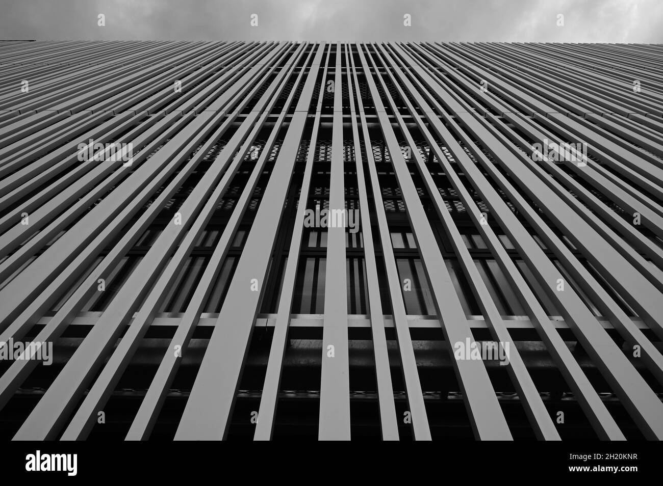 Grayscale of a high rise modern building exterior Stock Photo - Alamy