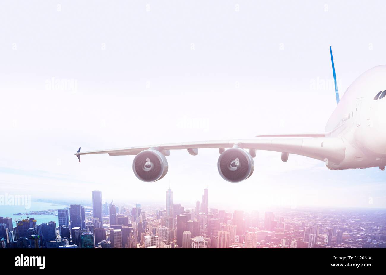 Wing of big jet airplane fly over Chicago downtown Stock Photo - Alamy