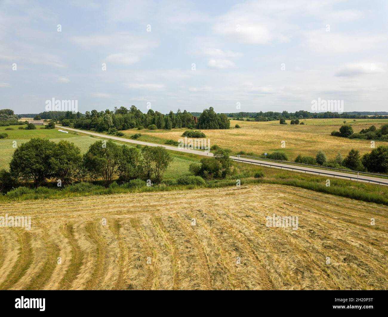 countryside roads in autumn colors with sunset light. drone image above ...