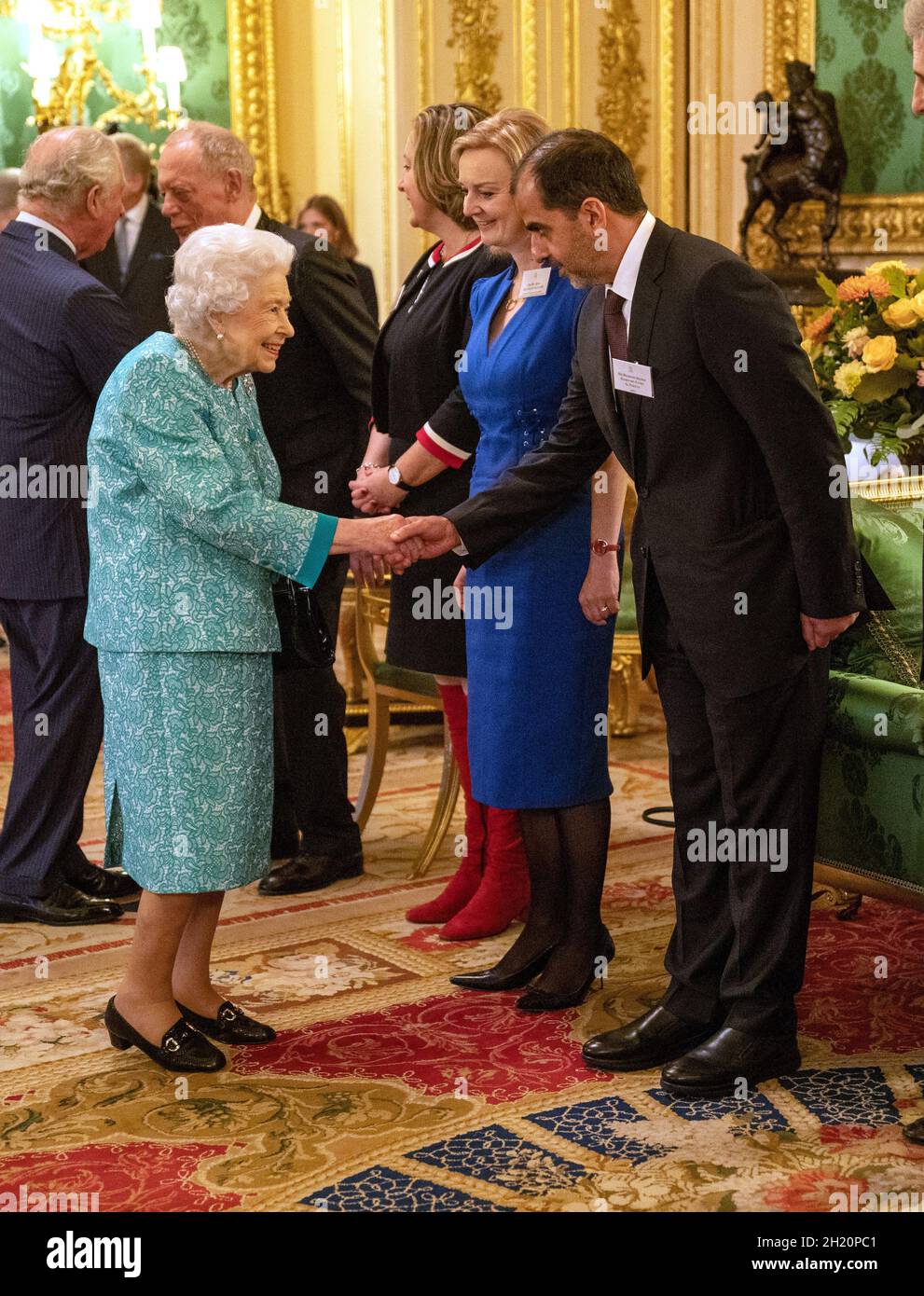 Queen Elizabeth II greets Foreign Secretary Liz Truss (second right) at ...