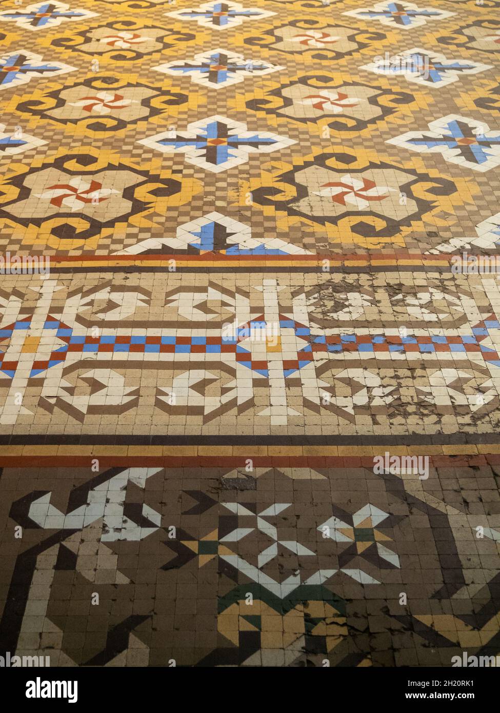 Geometric patterned floor in small tiles Stock Photo - Alamy