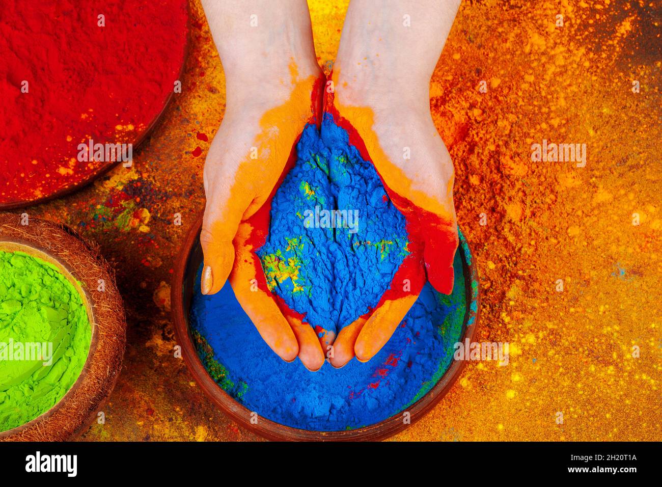 Hands holding Holi powder paint, view from above Stock Photo - Alamy