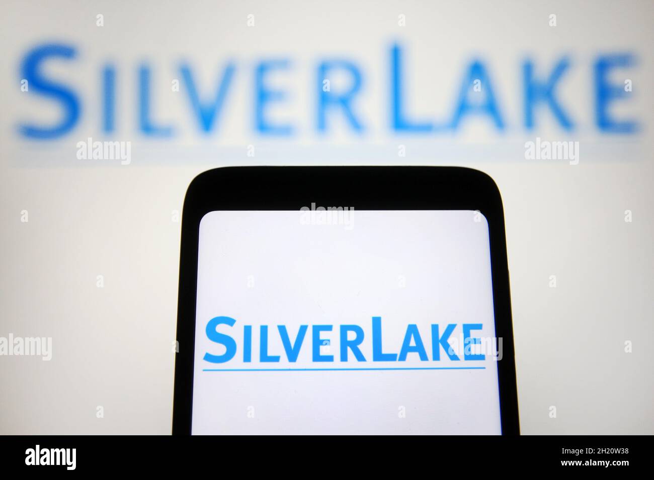 In this photo illustration, Silver Lake Technology Management, L.L.C ...