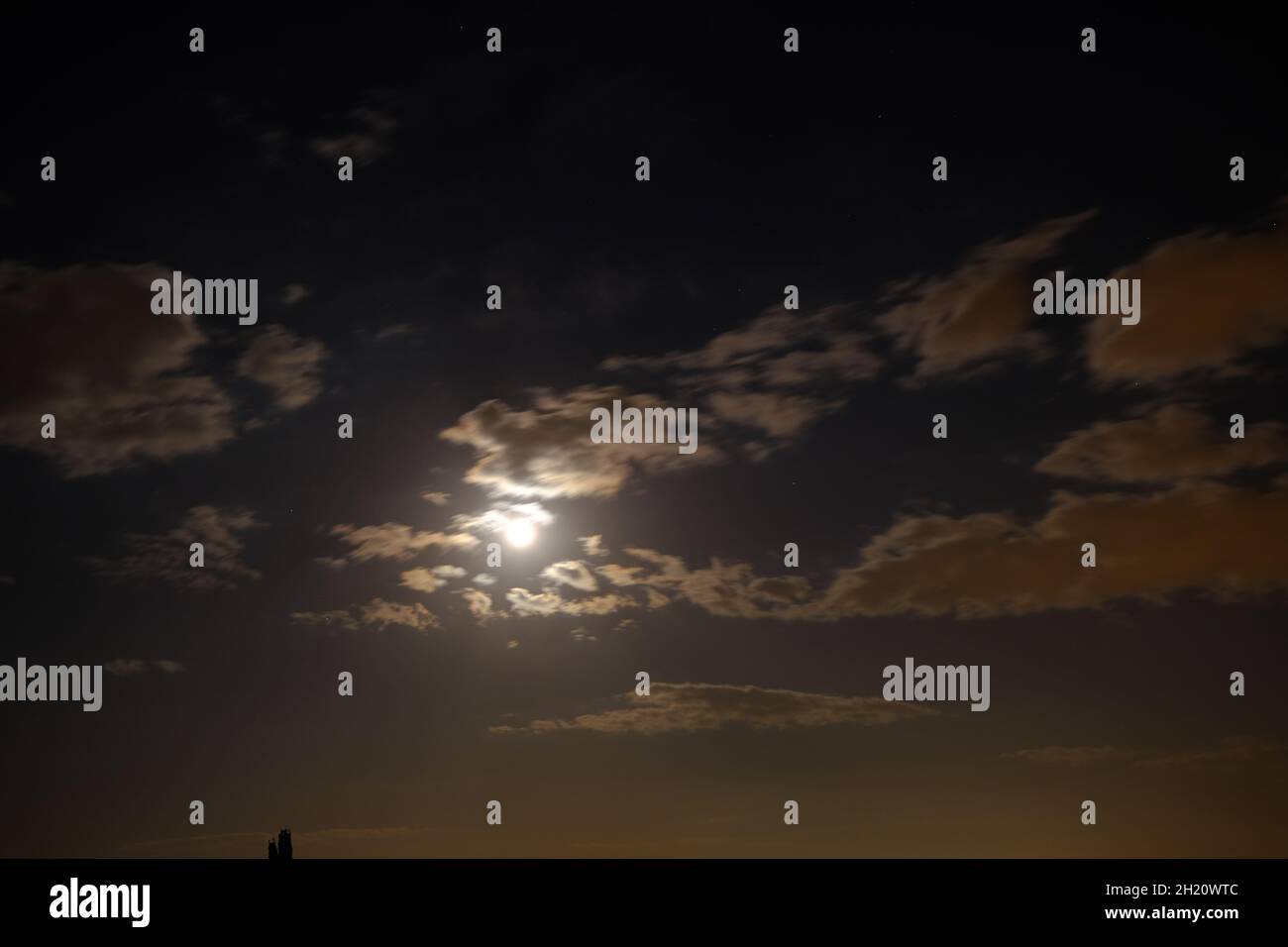 Night photo and full moon on sky and clouds in front of the moon over ...