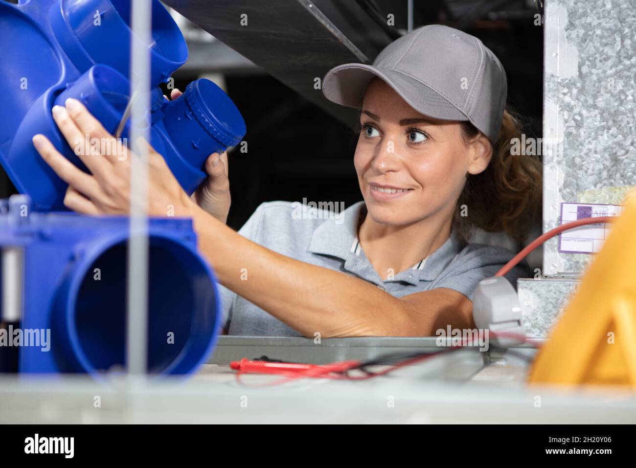 female electrician fixing ceiling wiring Stock Photo - Alamy