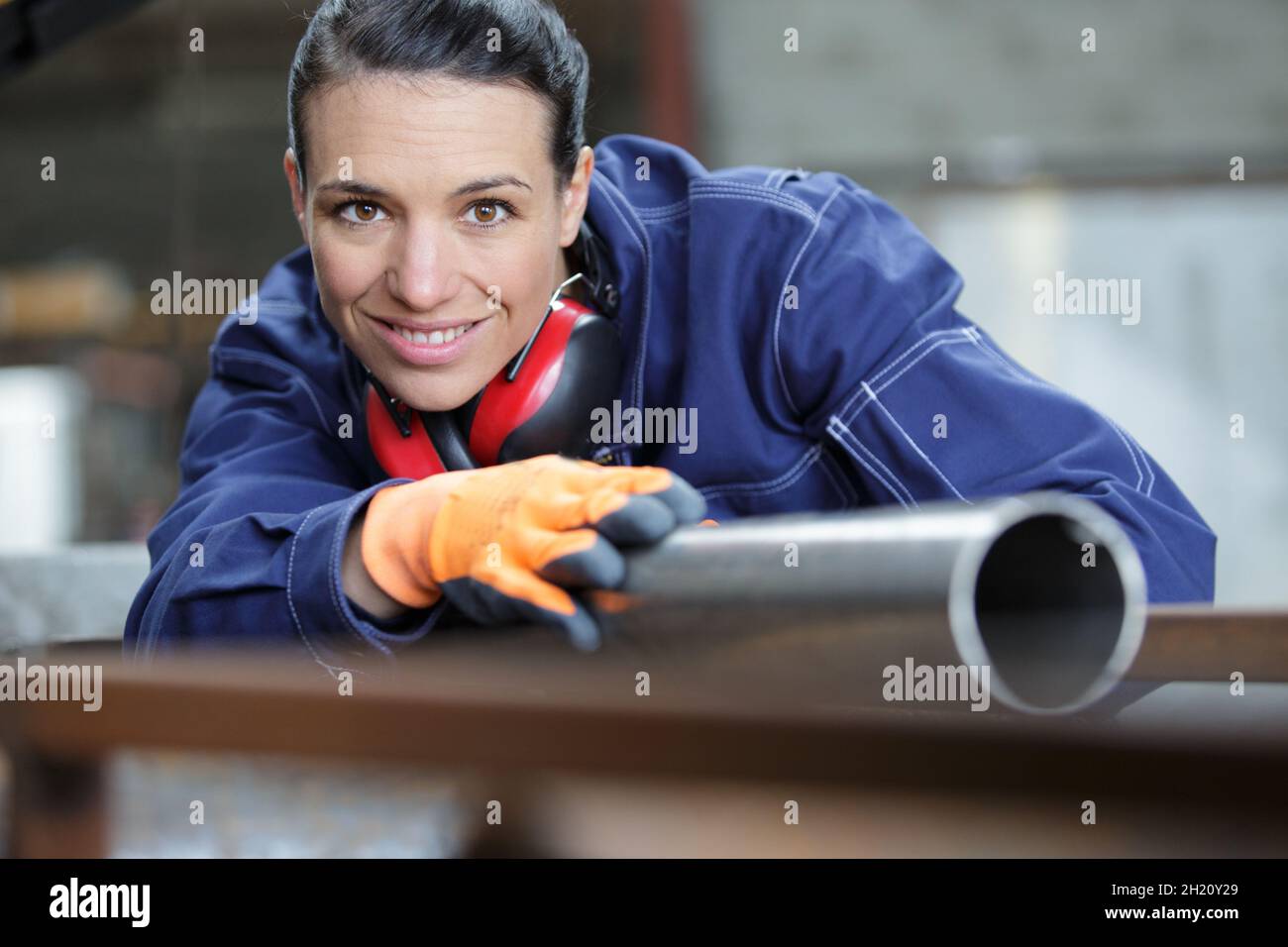 Young woman checking pipes hi-res stock photography and images - Alamy