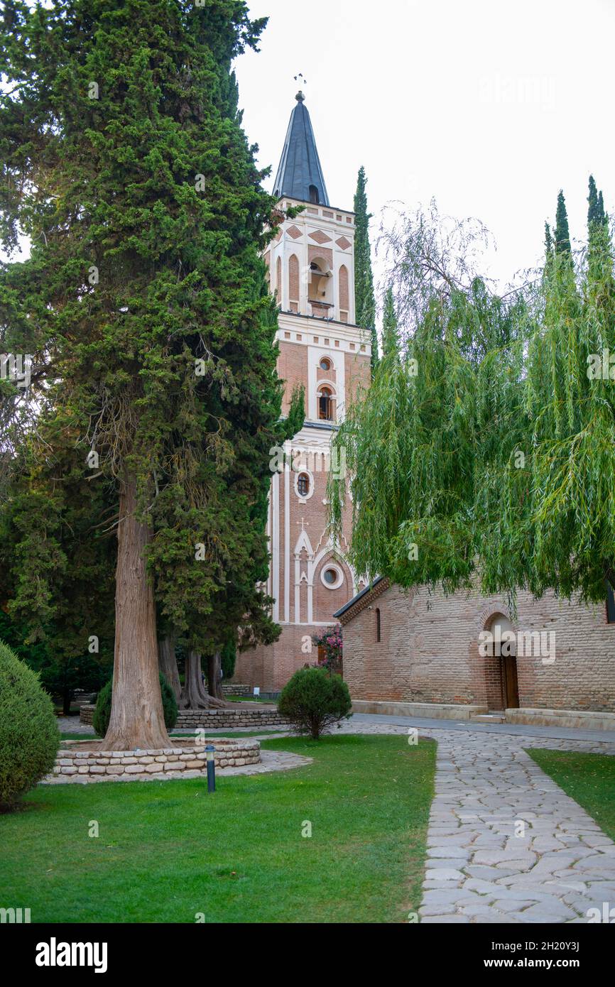 huge trees grow on the territory of the monastery Stock Photo - Alamy