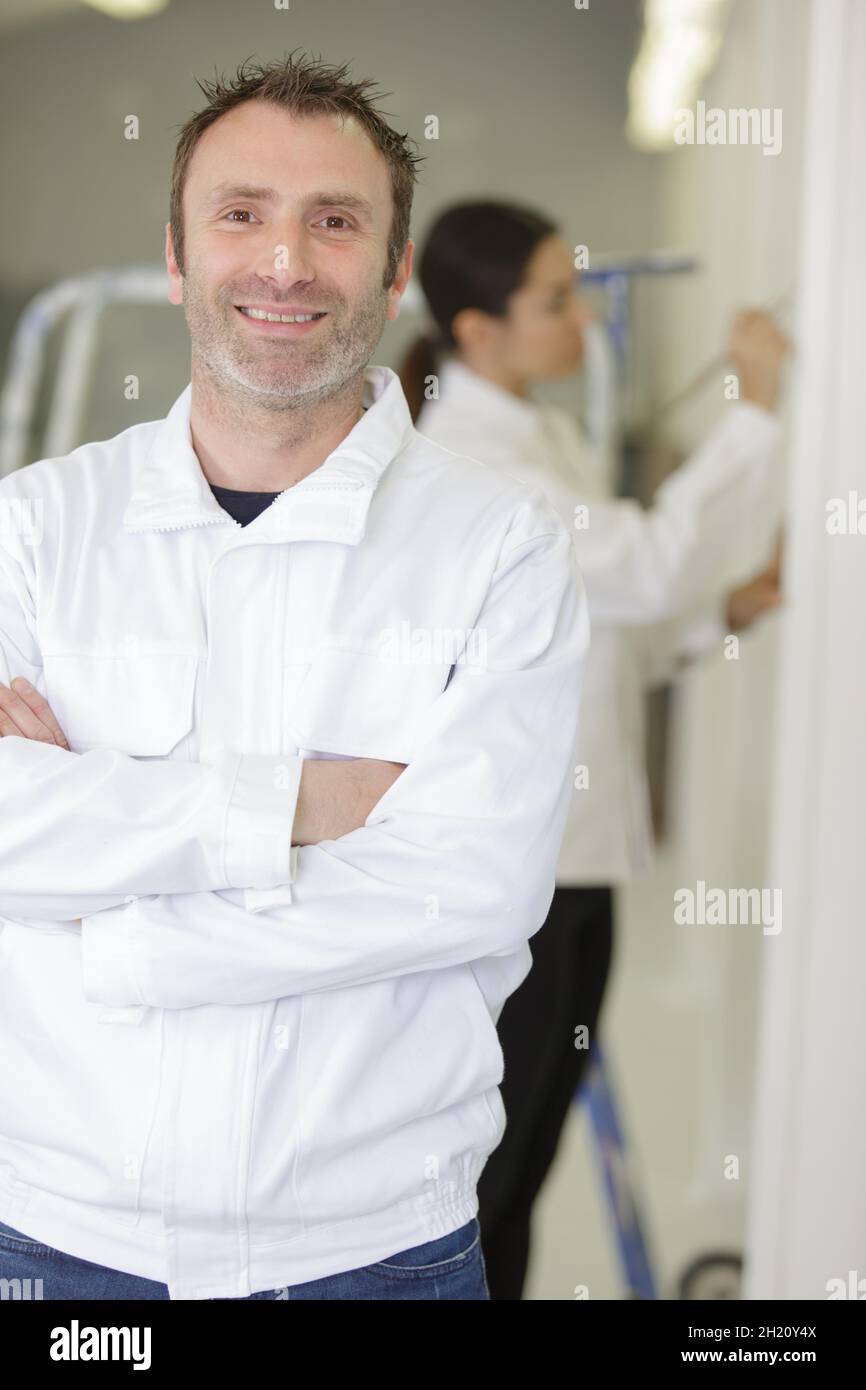 confident professional painter posing with arms crossed Stock Photo - Alamy